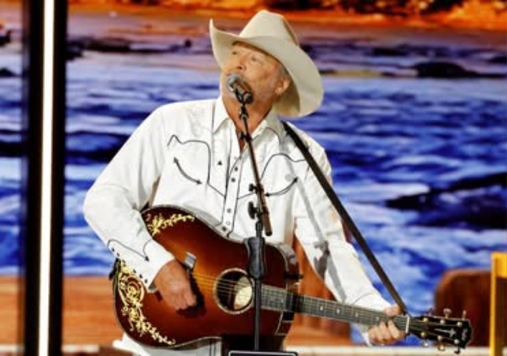 Alan Jackson returned to the Grand Ole Opry stage to perform one of his ...